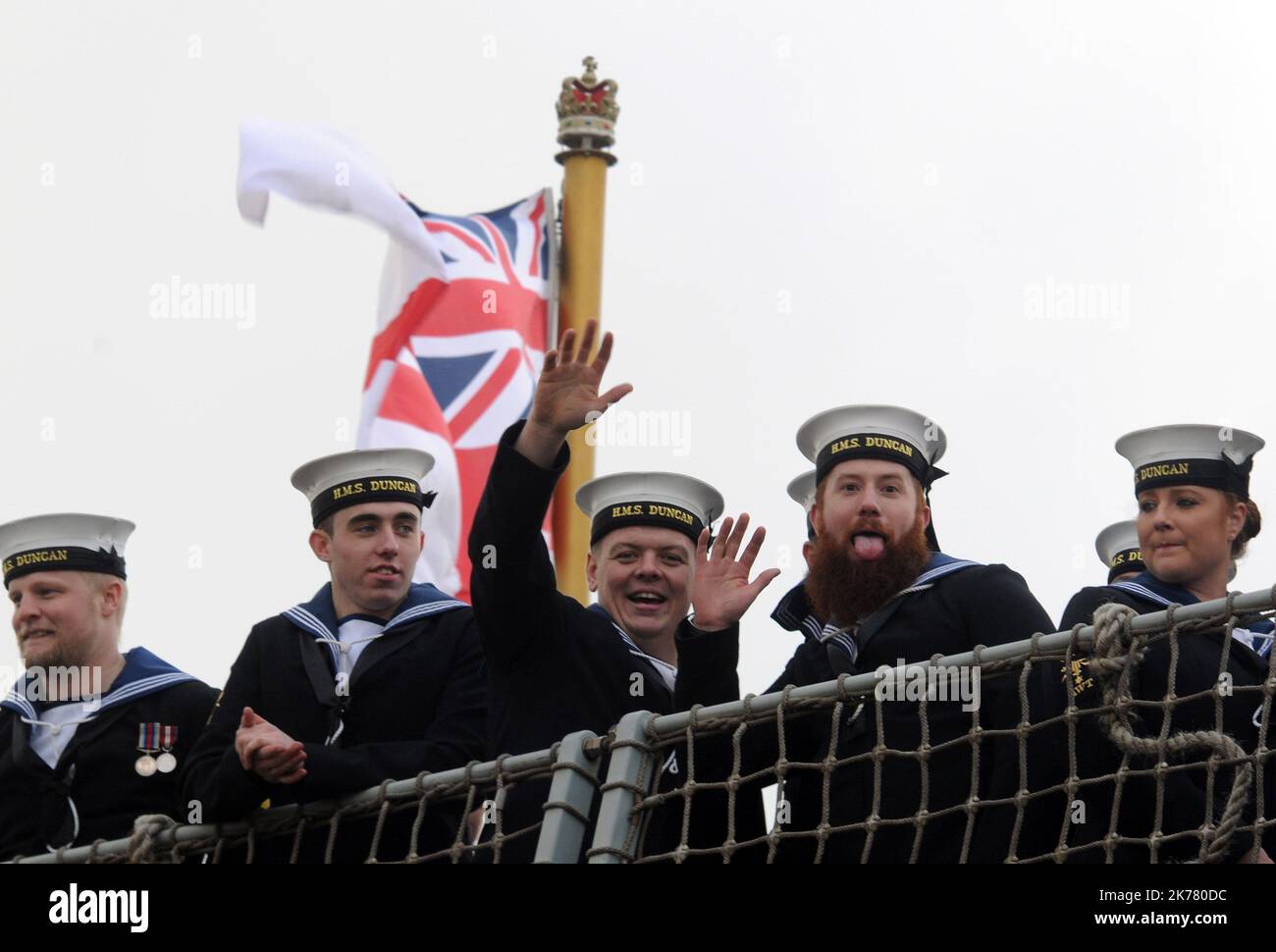 Crew members wave as the Royal avy's newest warship HMS Duncan returns ...