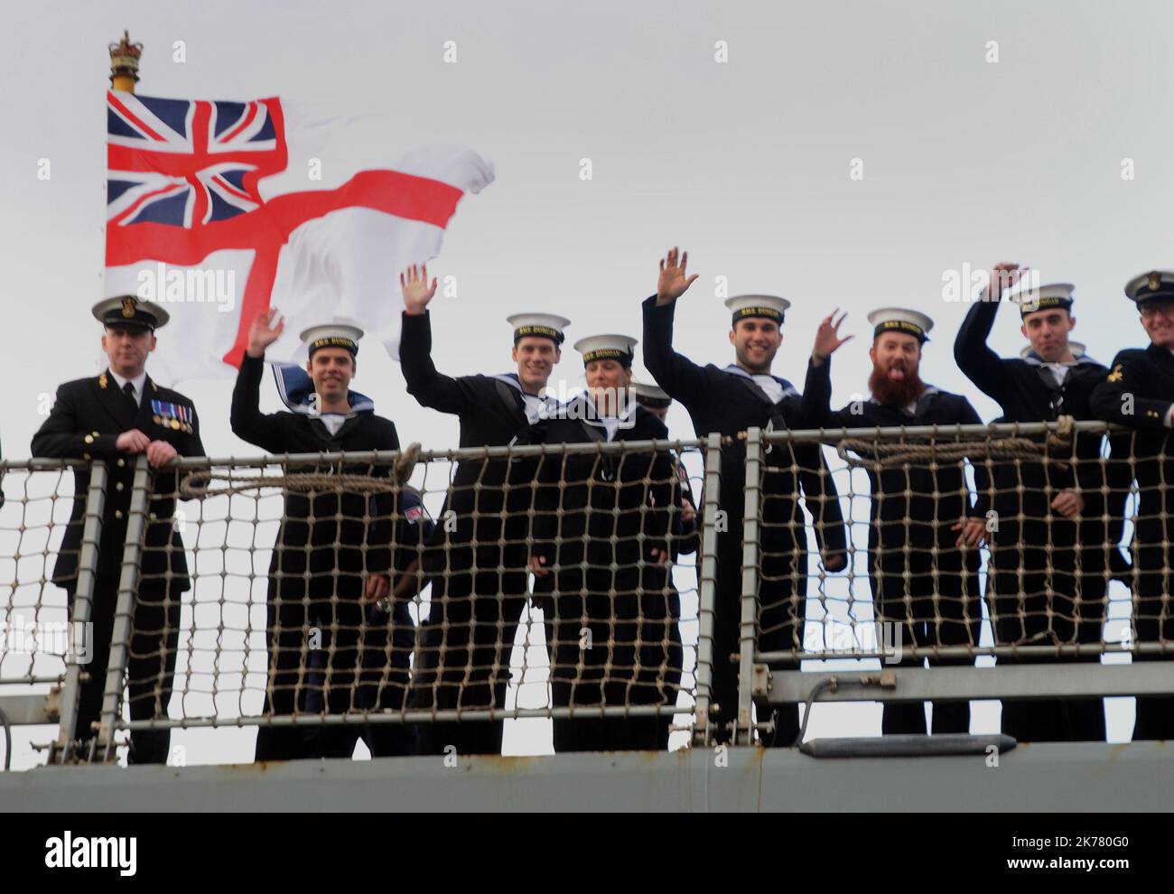 Crew members wave to family and friends as the Royal avy's newest ...