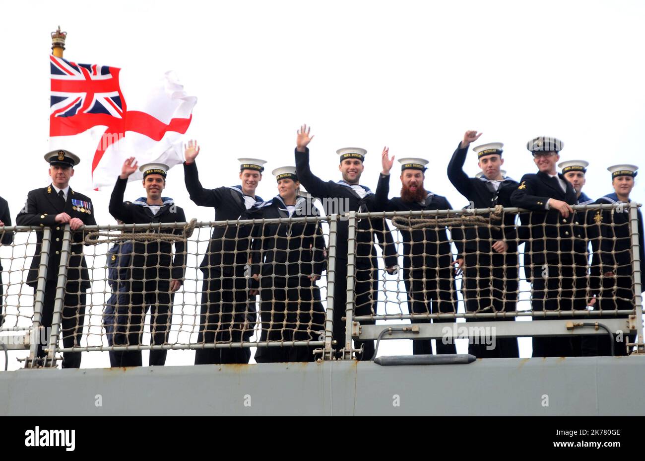 Crew members wave to families and loved ones as the Royal avy's newest ...