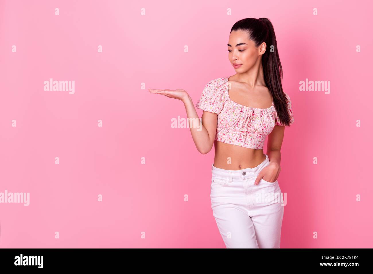 Portrait of pretty lovely indonesian girl look arm palm hold ...