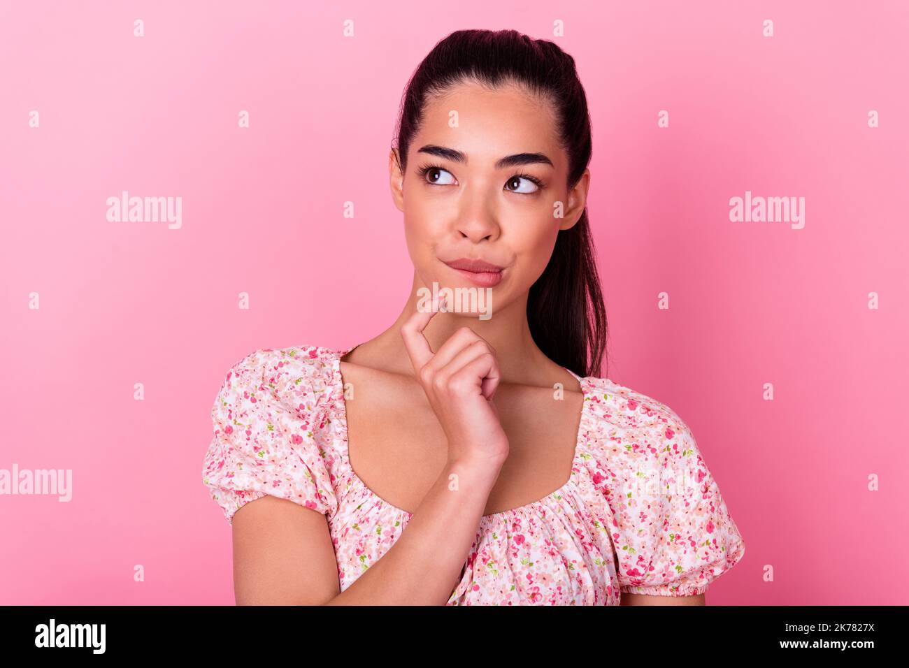 Photo of pretty minded lady biting lips finger touch chin look empty ...