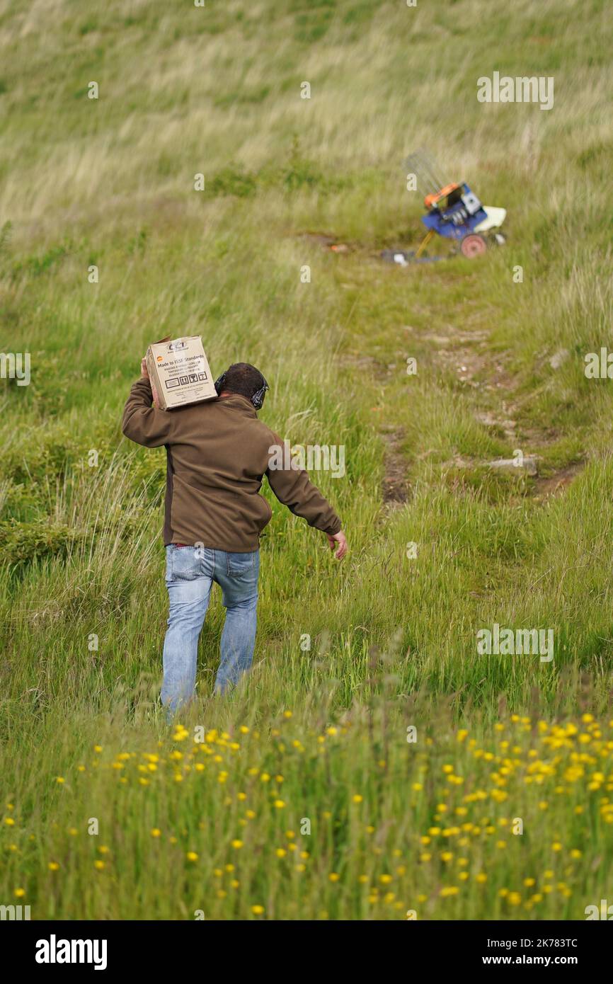 Clay Target Shooting - Sporting Welsh - man carrying box of targets up ...