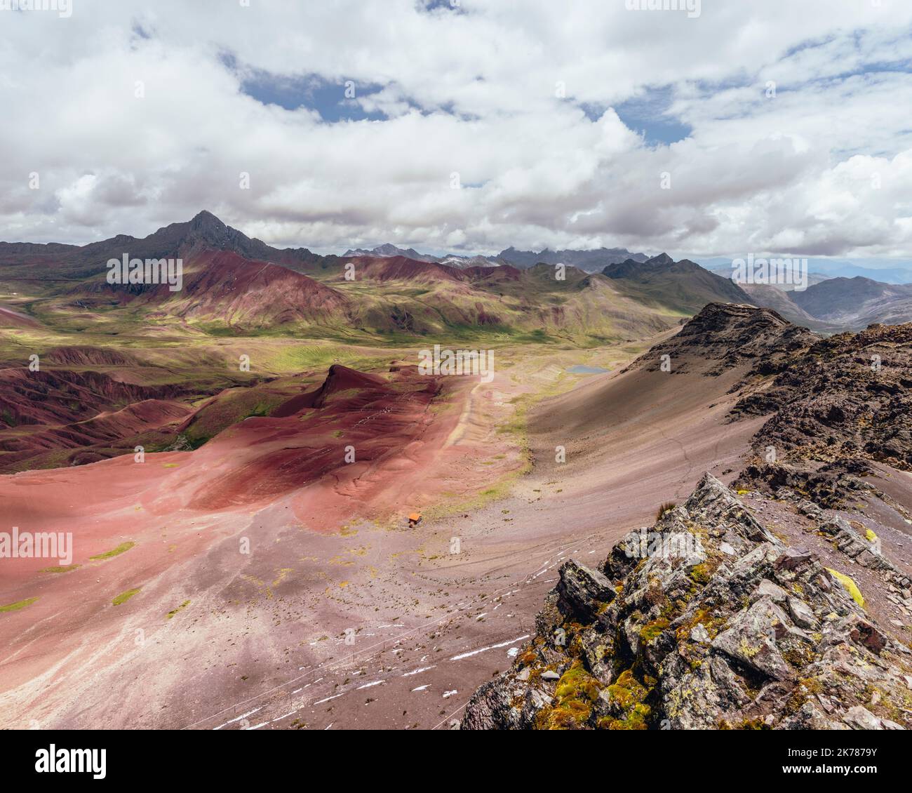 A beautiful landscape of a deep valley surrounded by red mountains ...