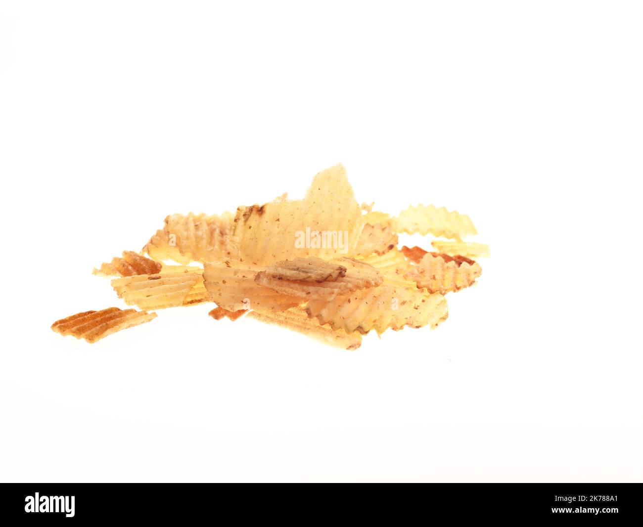 Clean background crinkle cut potato crisps in close up, food snack ...