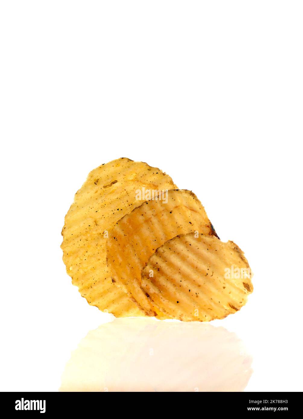Clean background crinkle cut potato crisps in close up, food snack ...