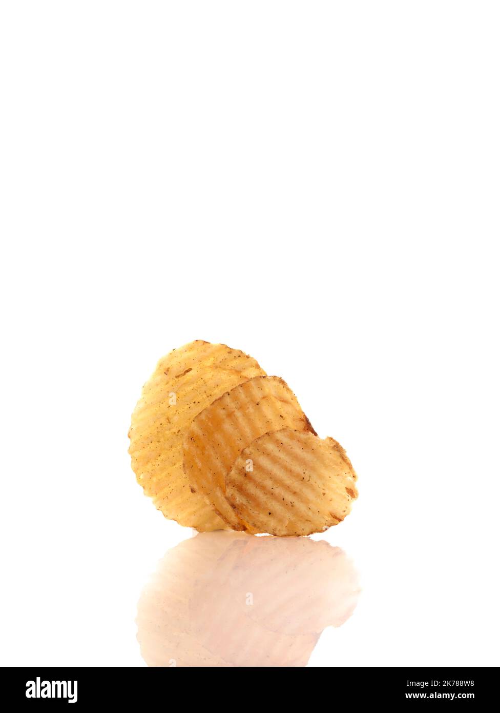Clean background crinkle cut potato crisps in close up, food snack ...