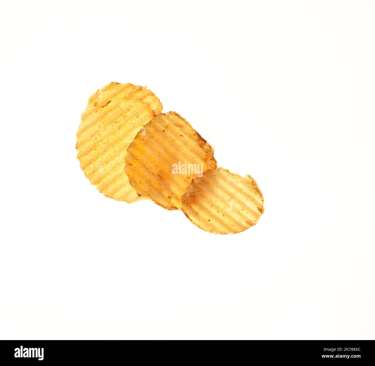Classic food still-life of Crinkle cut crisps on plain background Stock ...