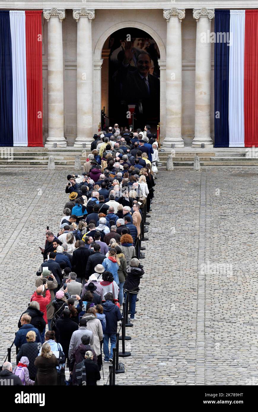 People queue at the entrance of Saint-Louis-des-Invalides Cathedral ...