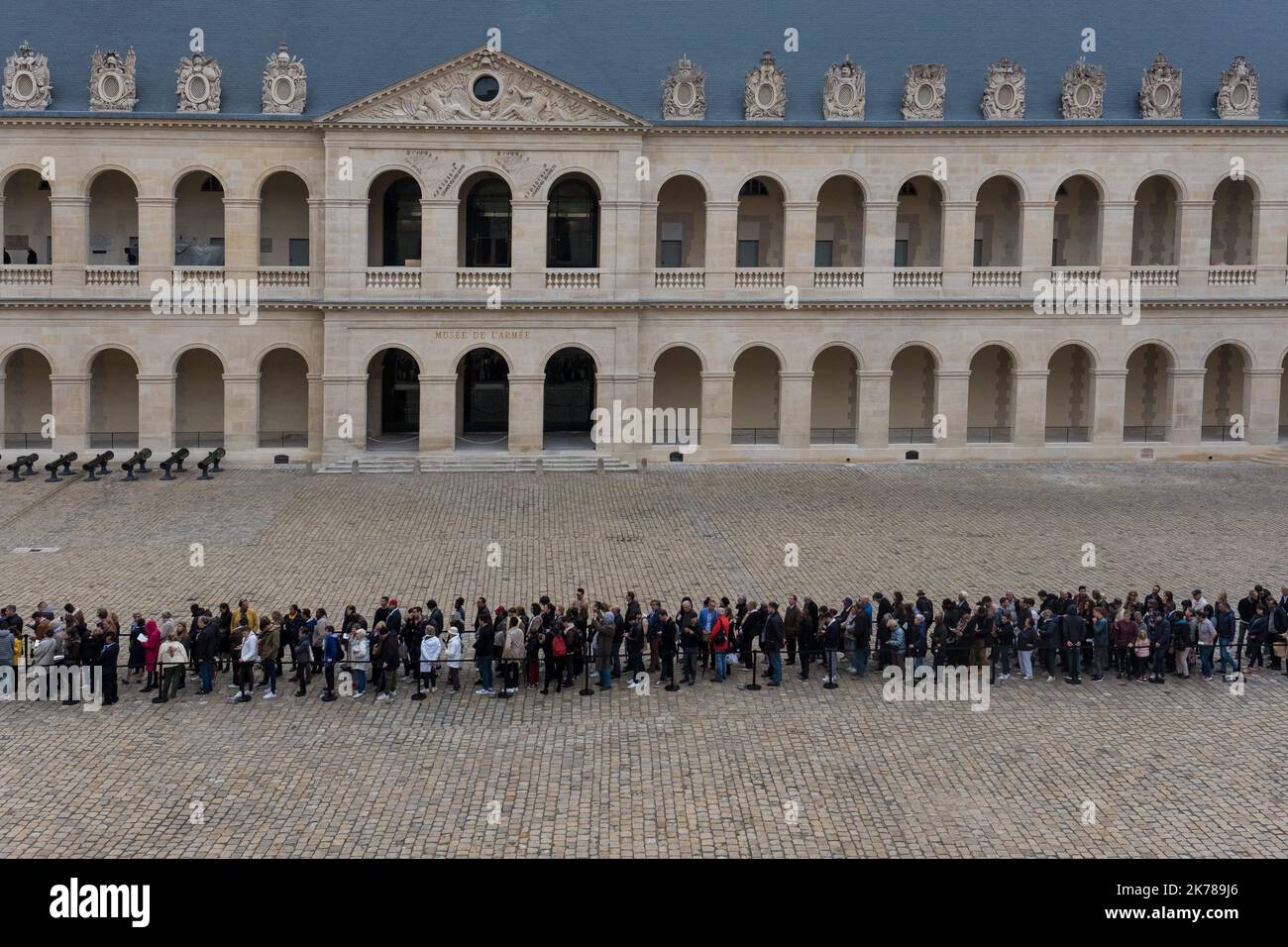 People queue at the entrance of Saint-Louis-des-Invalides Cathedral ...