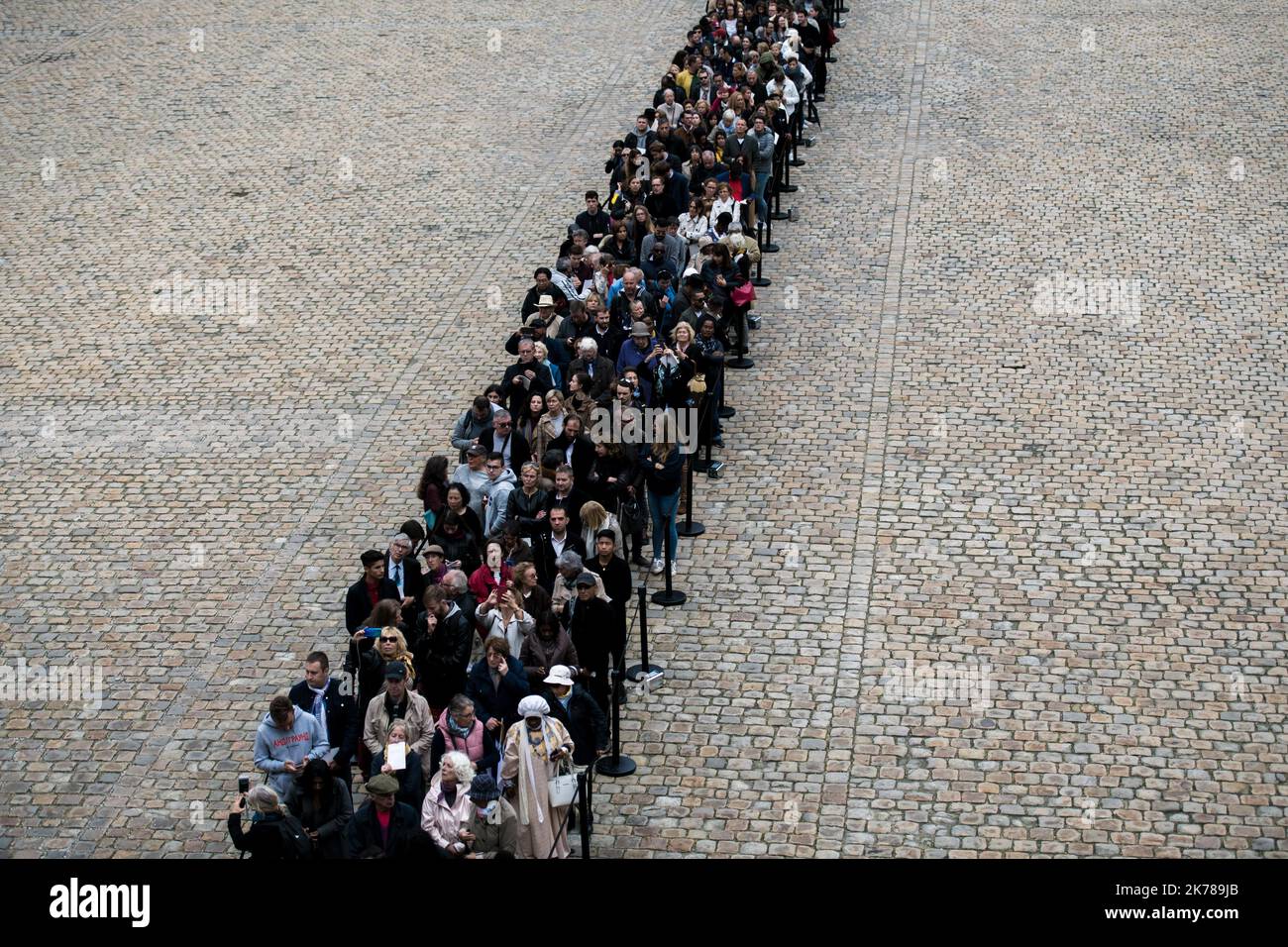 People queue at the entrance of Saint-Louis-des-Invalides Cathedral ...