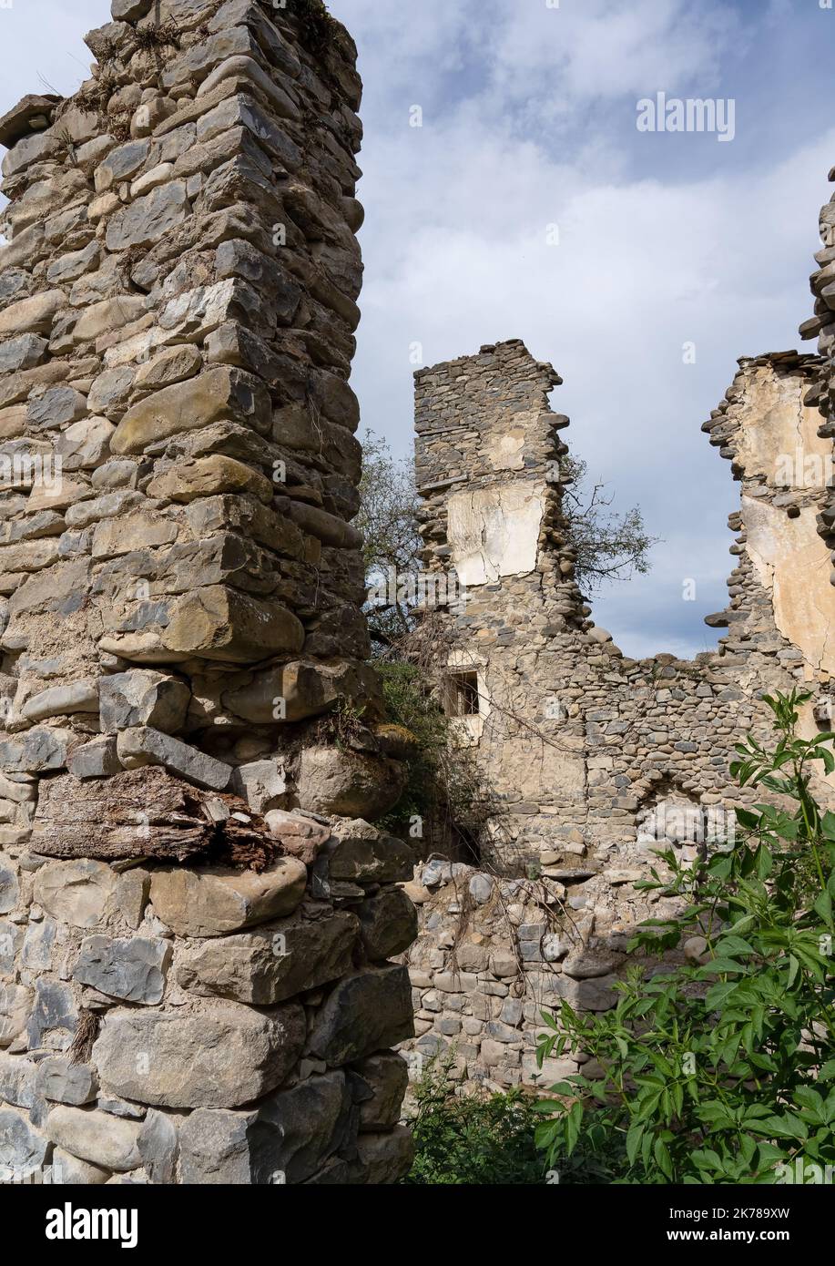 stone built walls and ruined buildings in an abandoned Spanish Pyrenees ...