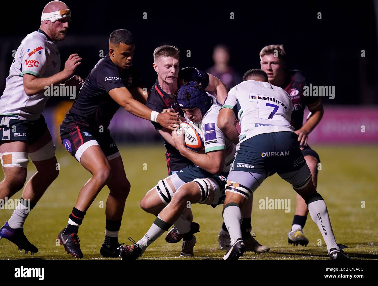 London Irish’s Josh Basham is tackled by Saracens’ Francis Moore during ...