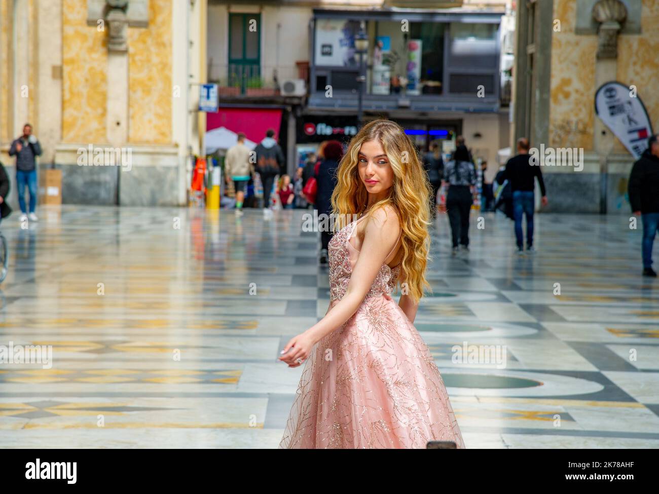 April 20 2022-Naples Italy-Beautiful woman dressed in a pink dress with ...