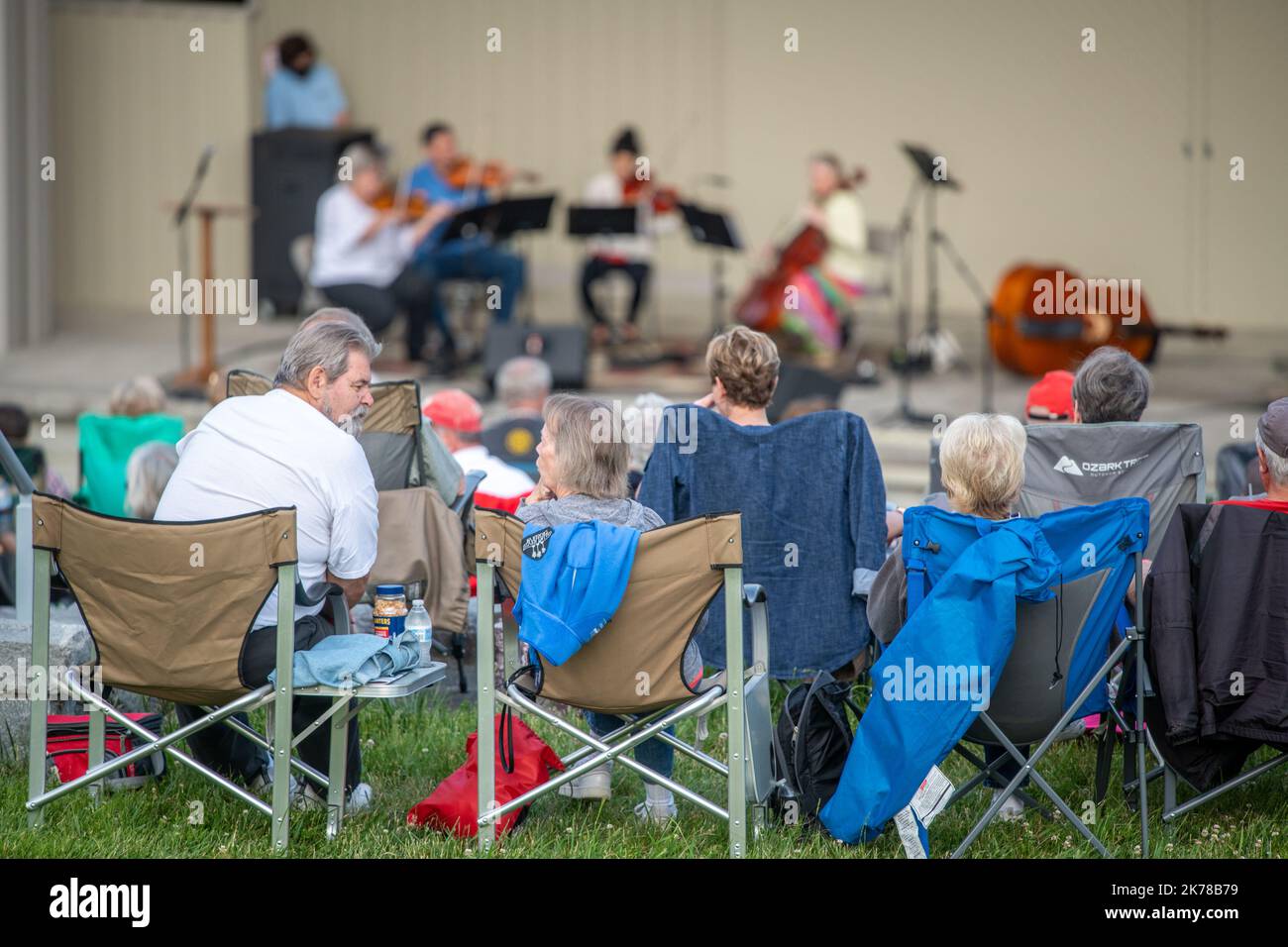 Couple watching performance on lawn at Blue Ridge Music Center Stock ...