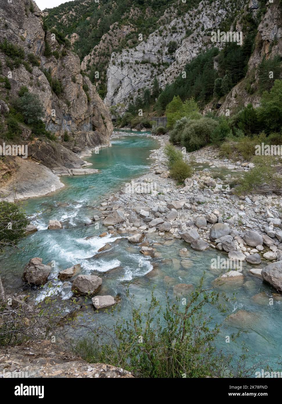 aqua blue clear mountain river water flowing through a stone gorge ...