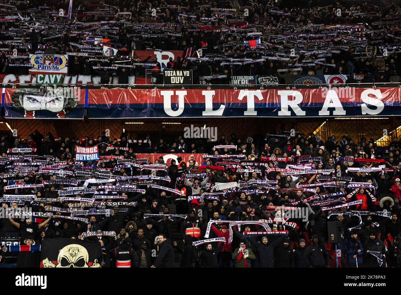 A general view of fans in the stands holding up banners and scarves ...