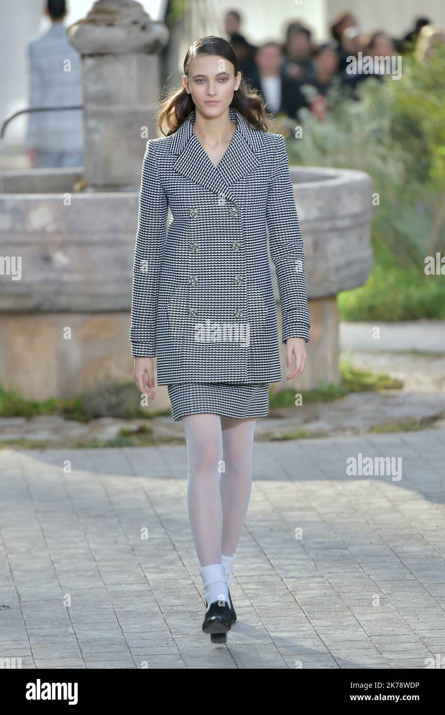 A model walks the runway during the Chanel Haute Couture Spring Summer ...