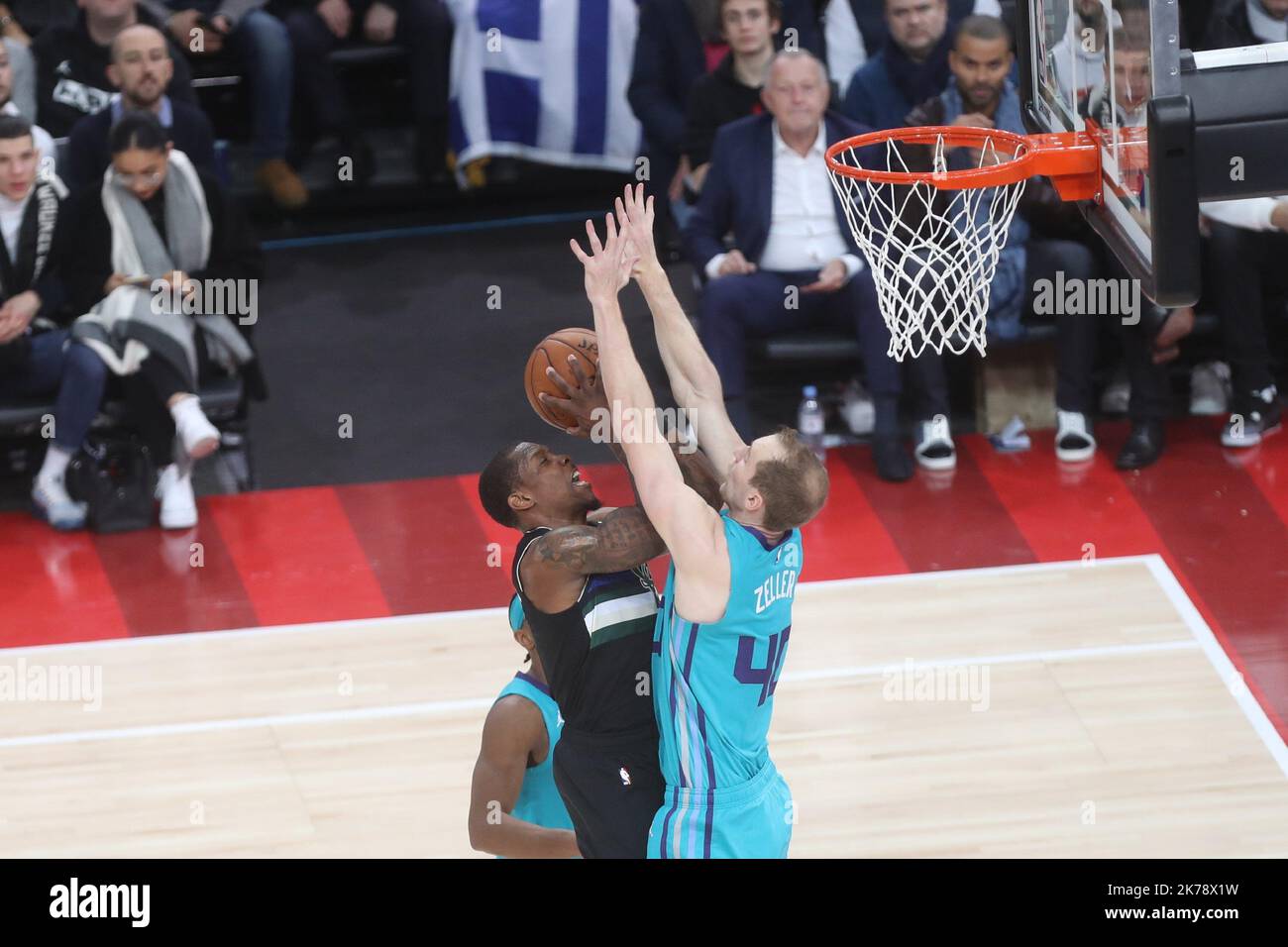 Eric Bledsoe of Milwaukee Bucks and Cody Zeller of Charlotte Hornets ...