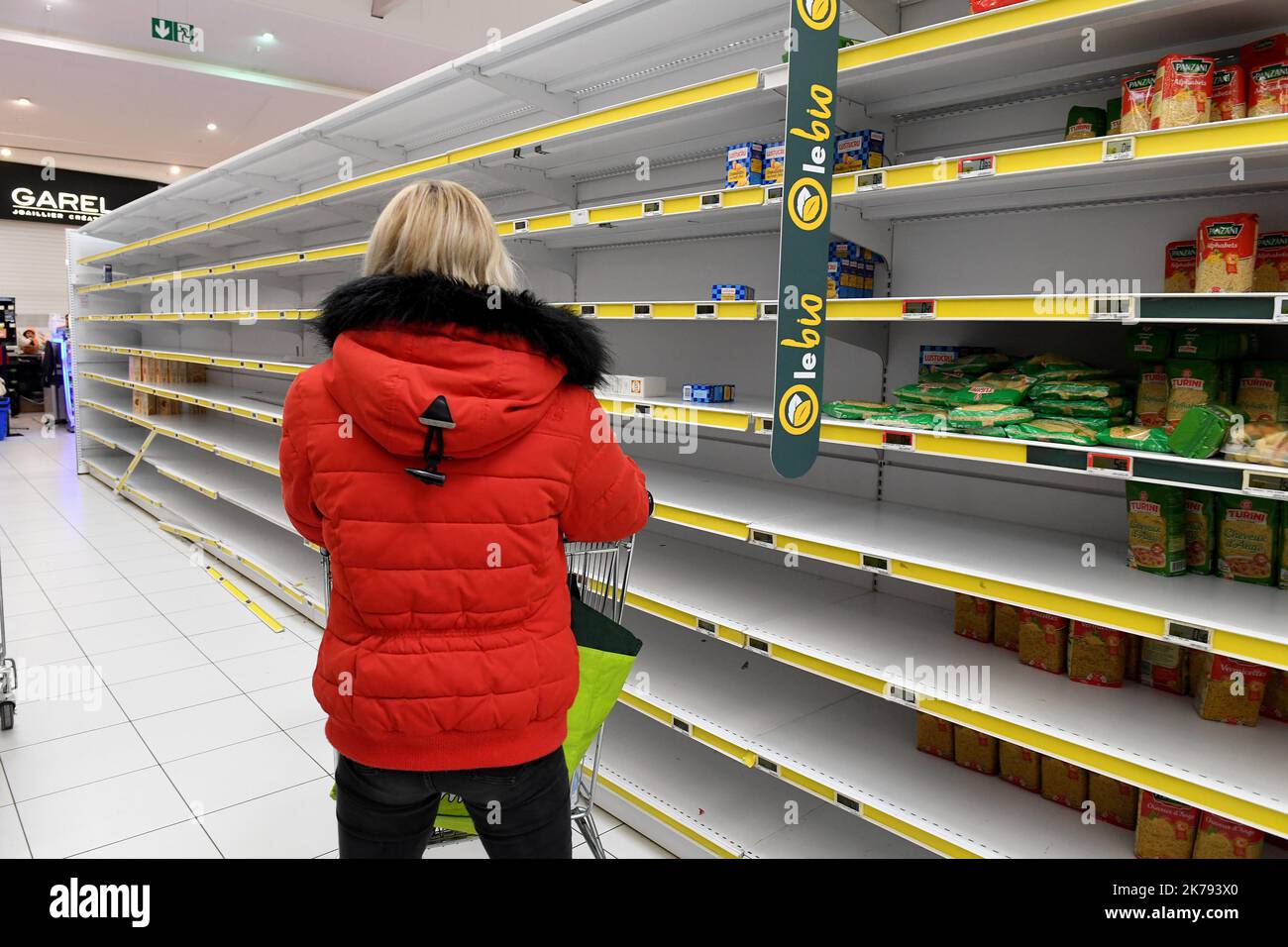 Panic-buying shoppers leave supermarket's shelves empty Stock Photo - Alamy