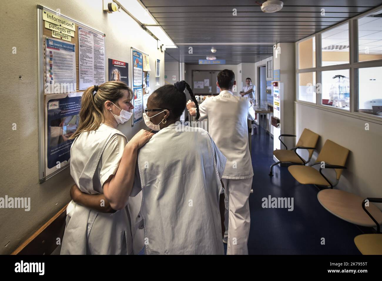 Nurses hug each other in the hallway of the Pau hospital Stock Photo ...