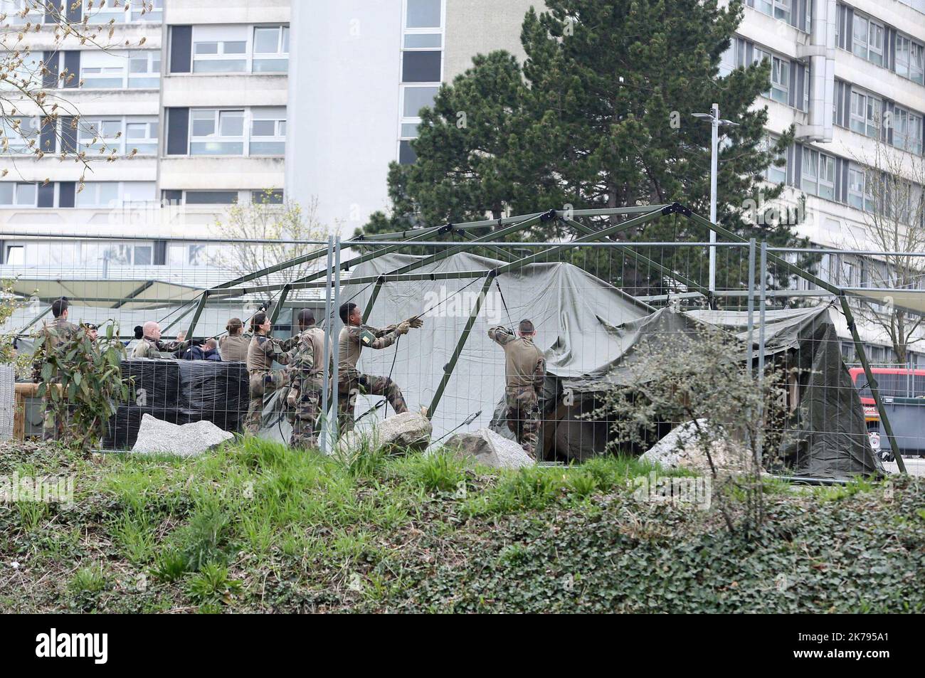 Soldiers are installing a military field hospital near the Emile Muller ...