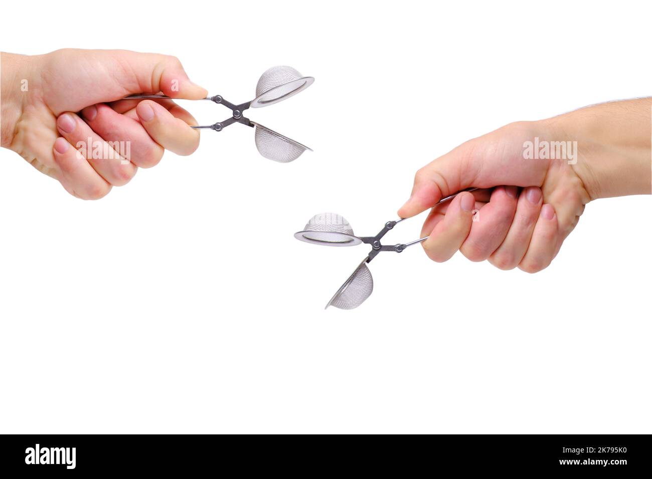 Strainer for brewing tea and sprinkling in your hand on white ...