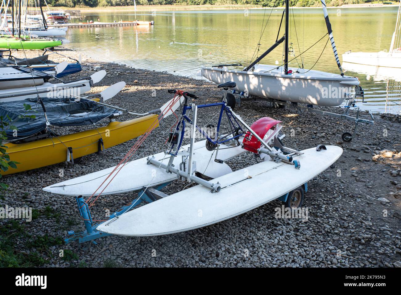A bicycle transformed into a pedalo on a beach by a lake Stock Photo ...