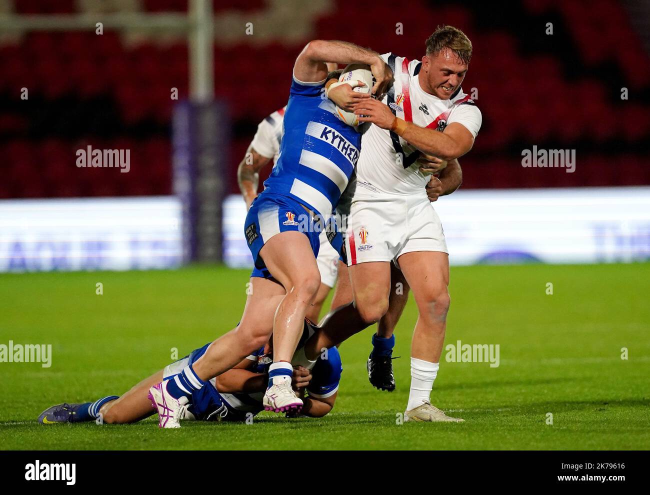 France’s Paul Seguier is tackled by Greece’s Nicholas Flocas and ...