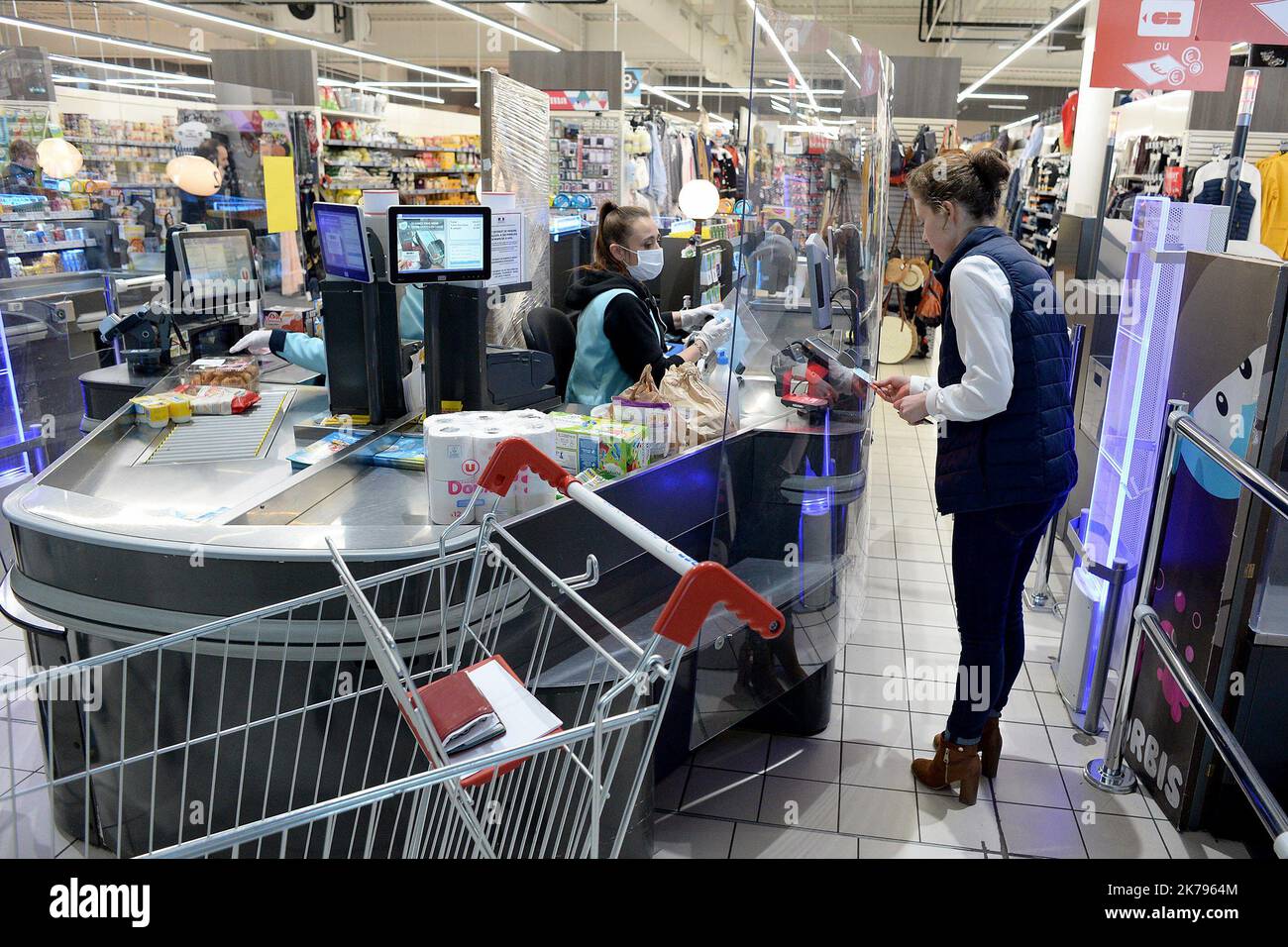 At the Super U store in Châteaubourg, the cashier hostesses are ...