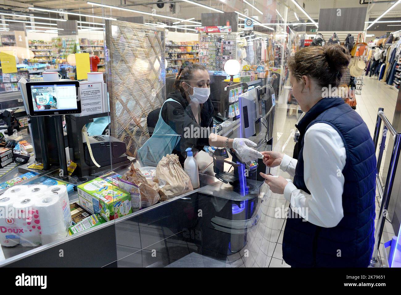 At the Super U store in Châteaubourg, the cashier hostesses are ...