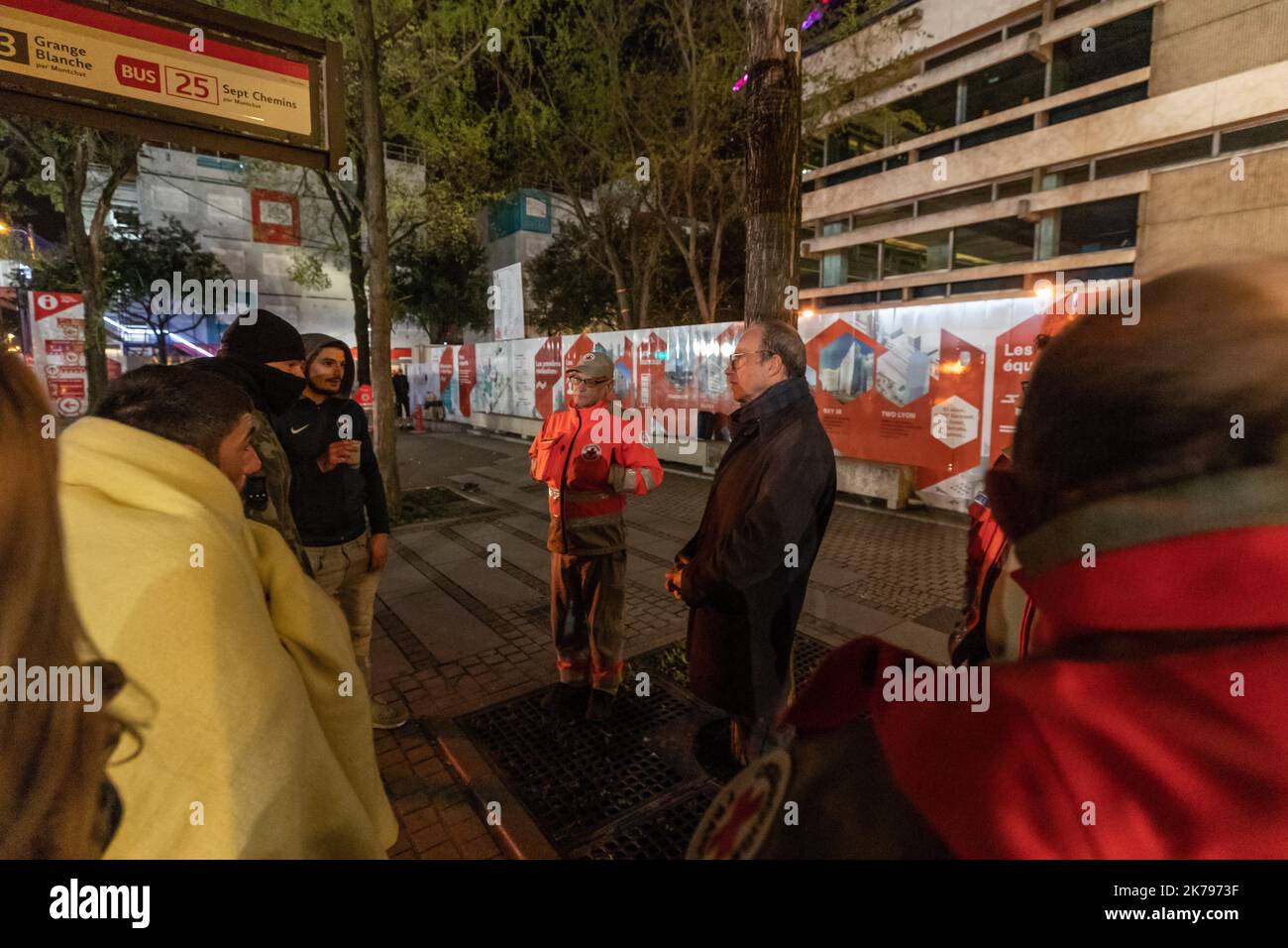 The prefect Pascal Mailhos talks with volunteers from the French Red ...