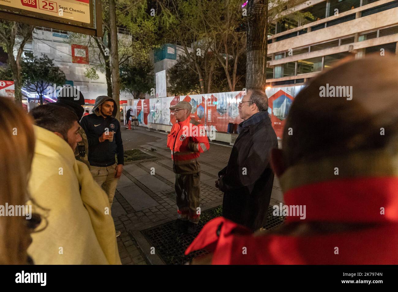 The prefect Pascal Mailhos talks with volunteers from the French Red ...