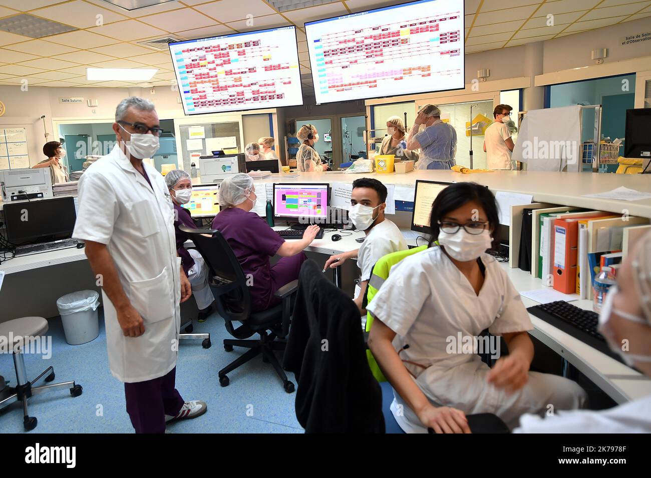 Nurses and doctors wear face masks to protect themselves while working ...