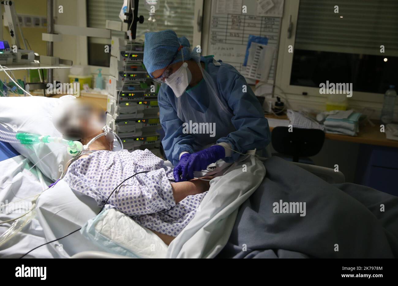 A nurse monitors the equipment. All patients with covid-19 are ...
