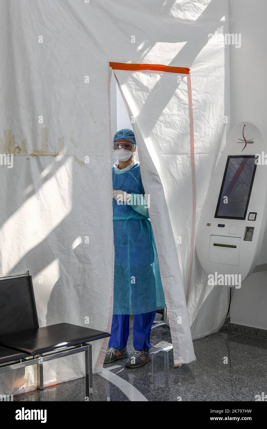 A hospital staff member wears protective clothing in a coronavirus ...
