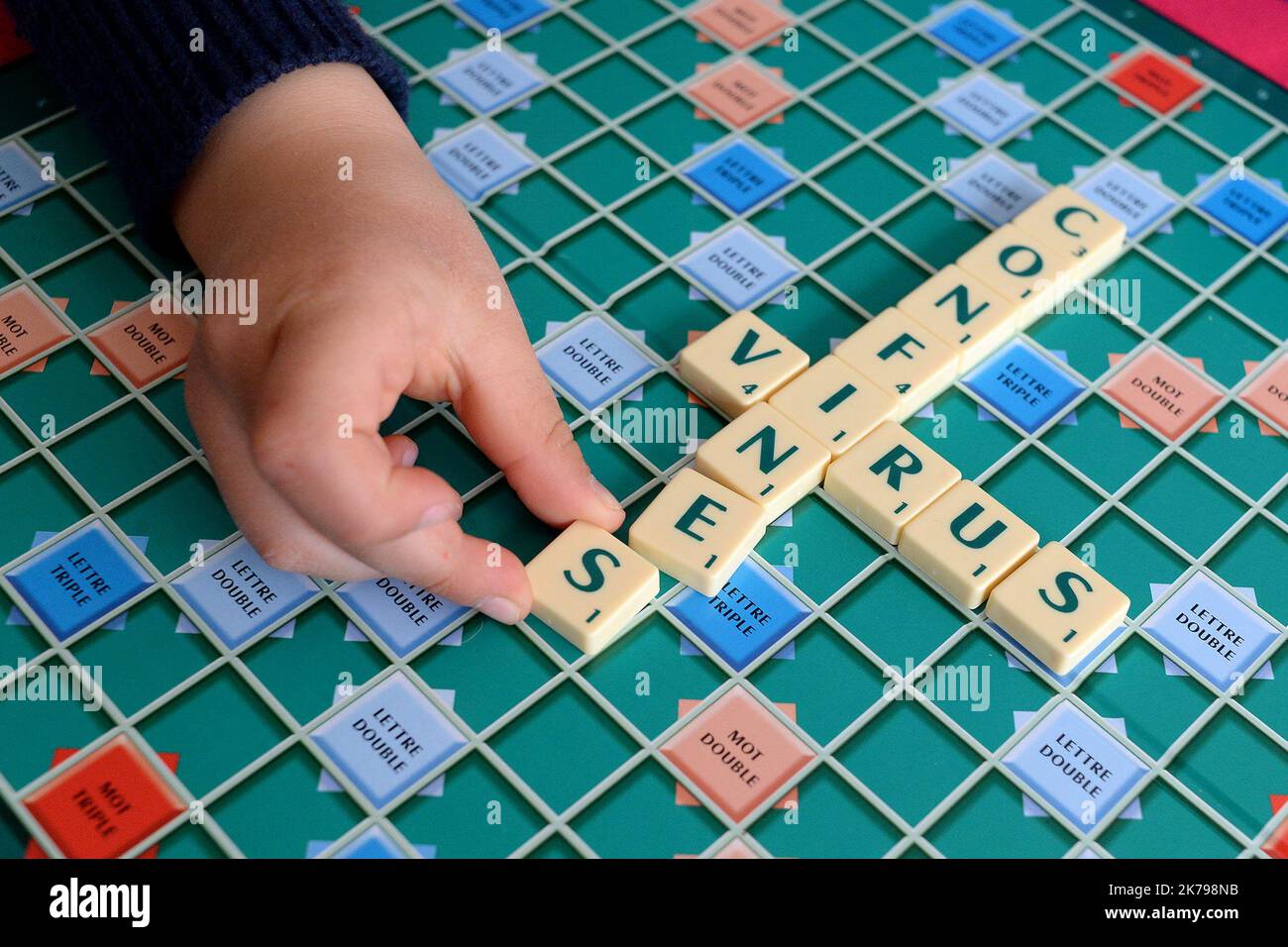 People play Scrabble during the lockdown confinement caused by the ...