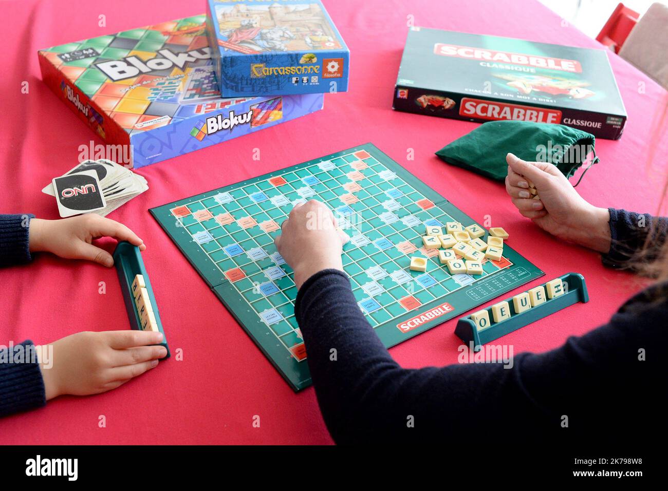 People play Scrabble during the lockdown confinement caused by the ...