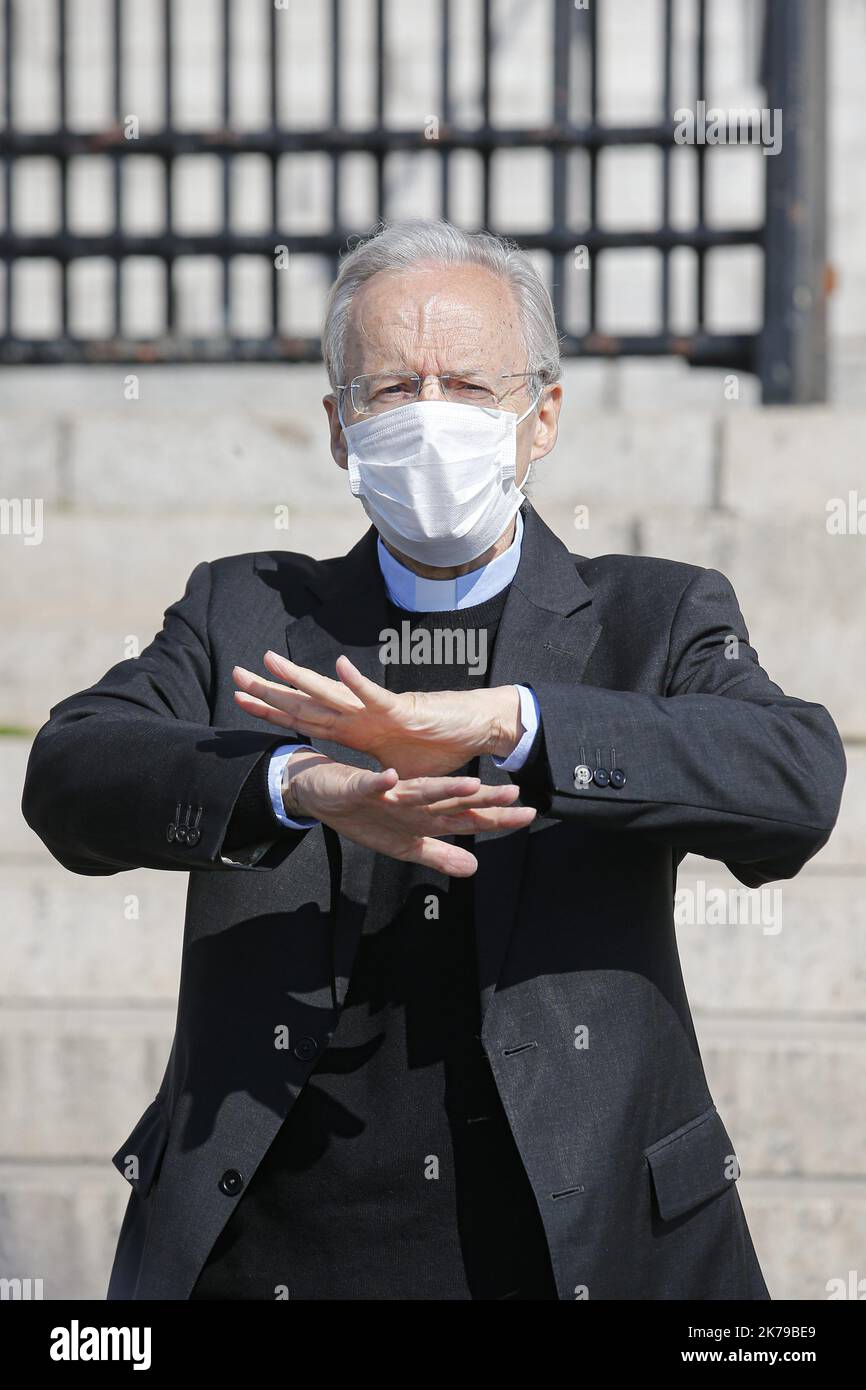Rector of the Sacre Coeur Basilica Msgr Jean Laverton, wears a ...