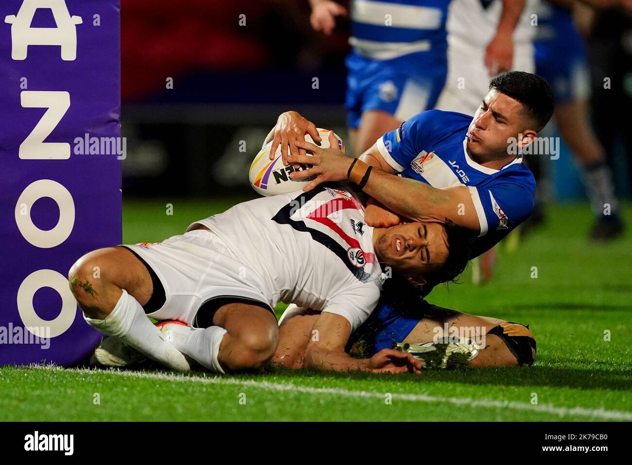 France’s Arthur Mourgue scores a try past Greece’s Alrix Da Costa ...