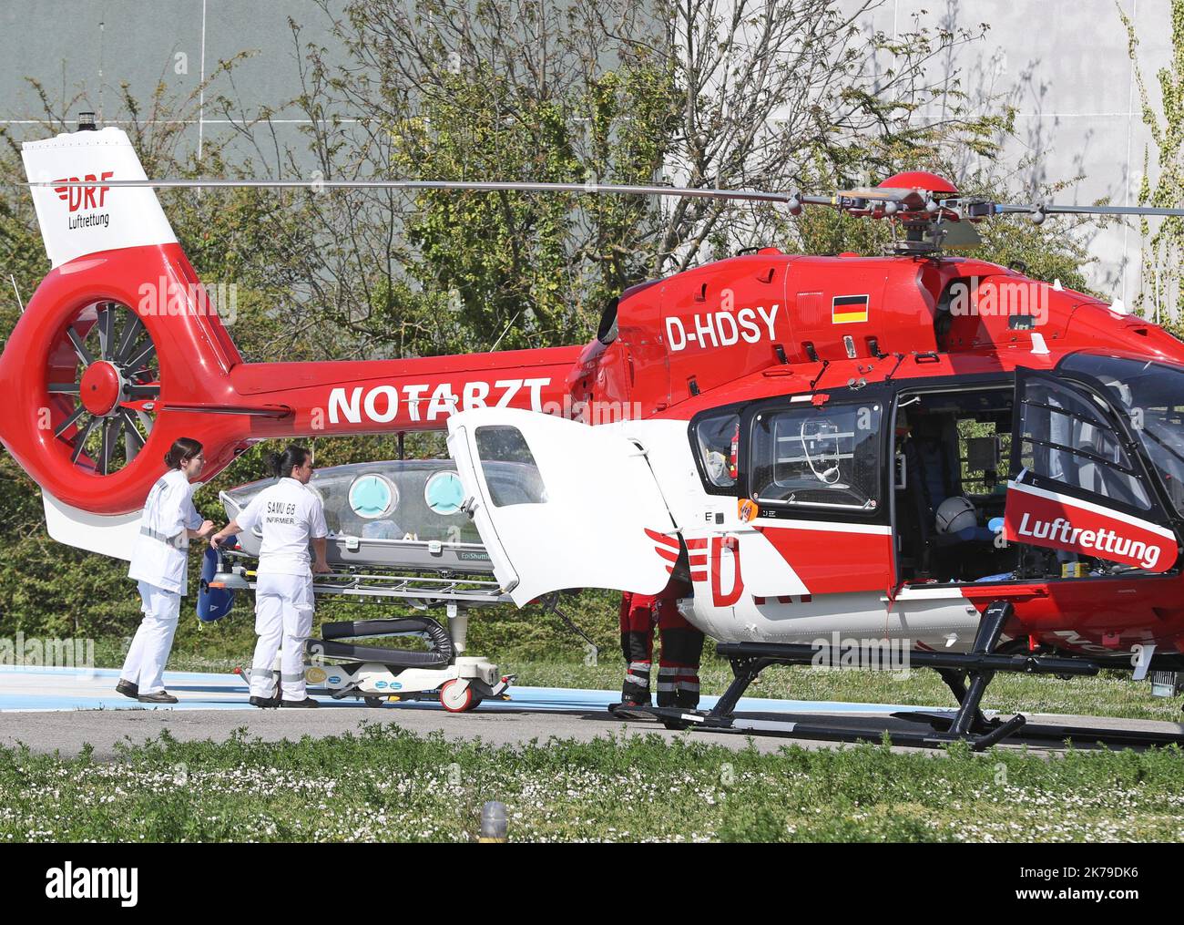 A German helicopter prepares to take off after dropping a patient with ...