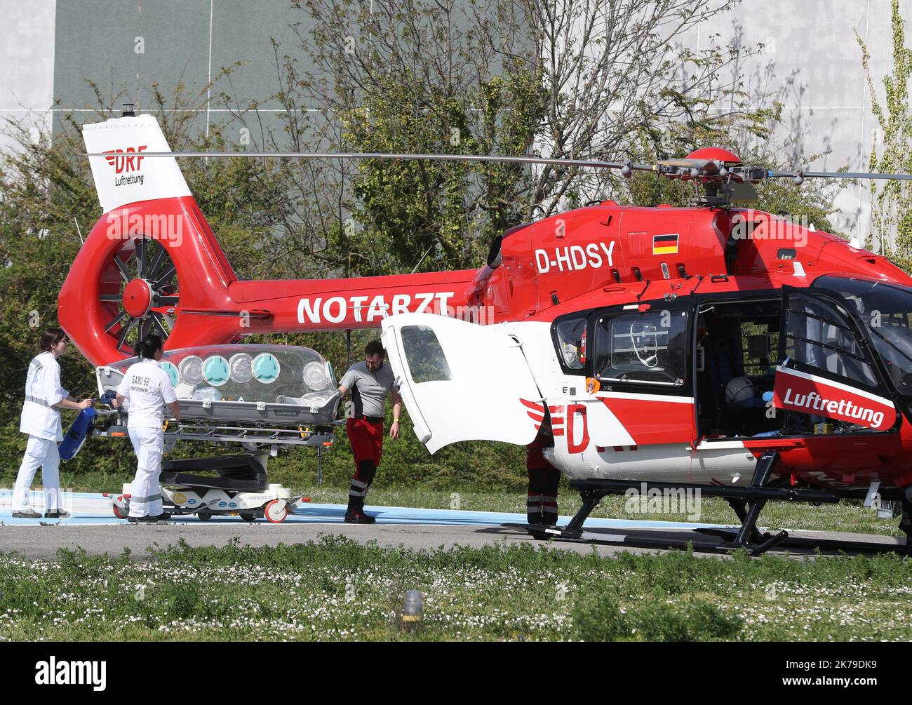 A German helicopter prepares to take off after dropping a patient with ...