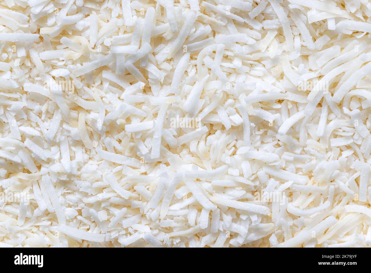 Coconut flakes background. Top view, close up of shredded white fruit ...