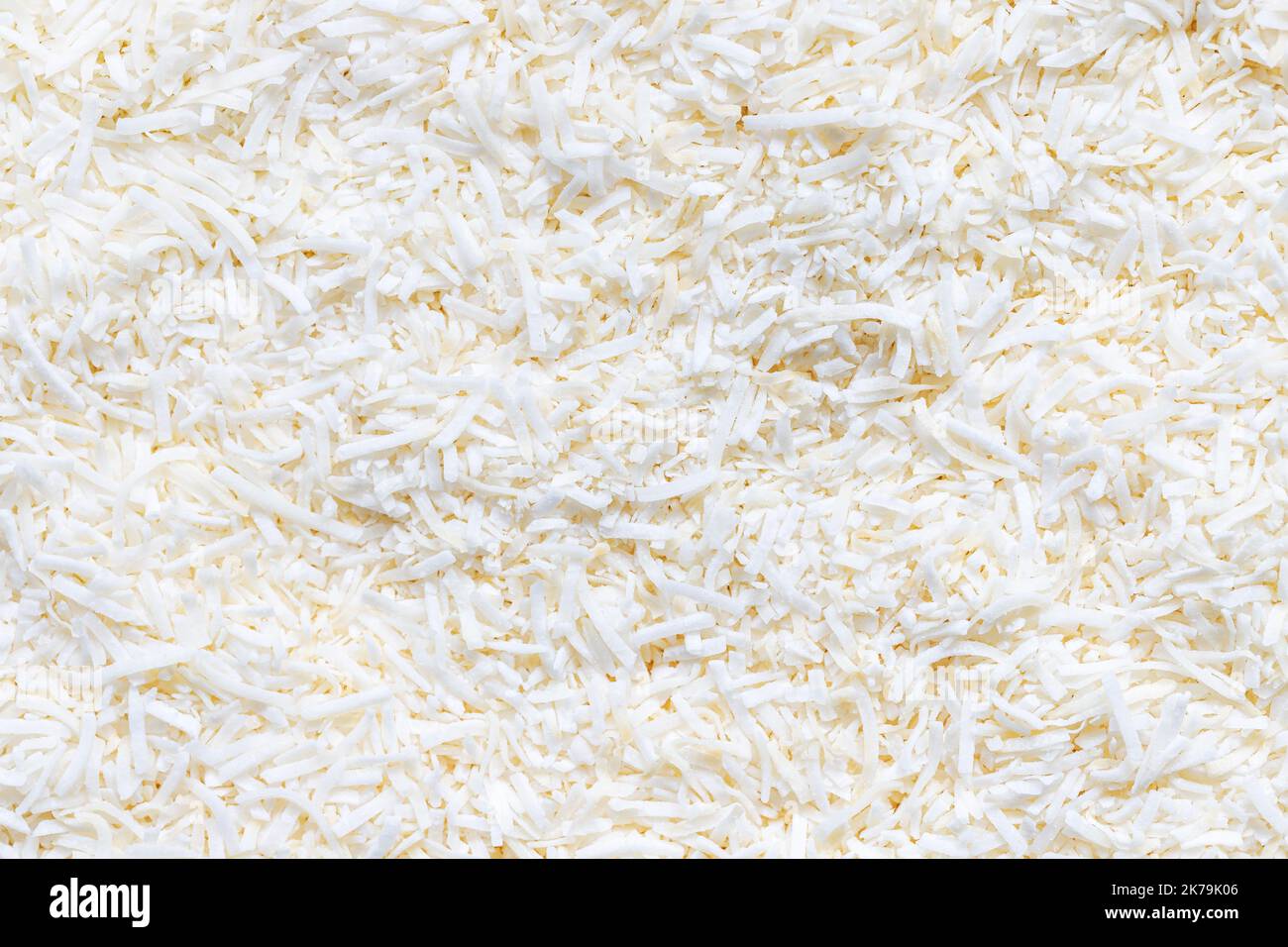 Coconut flakes background. Top view of shredded dry fruit Stock Photo ...