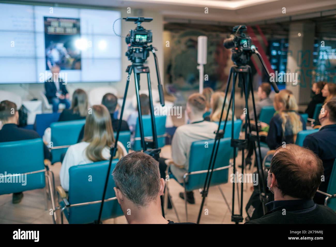Audience and camera during presentation Stock Photo - Alamy