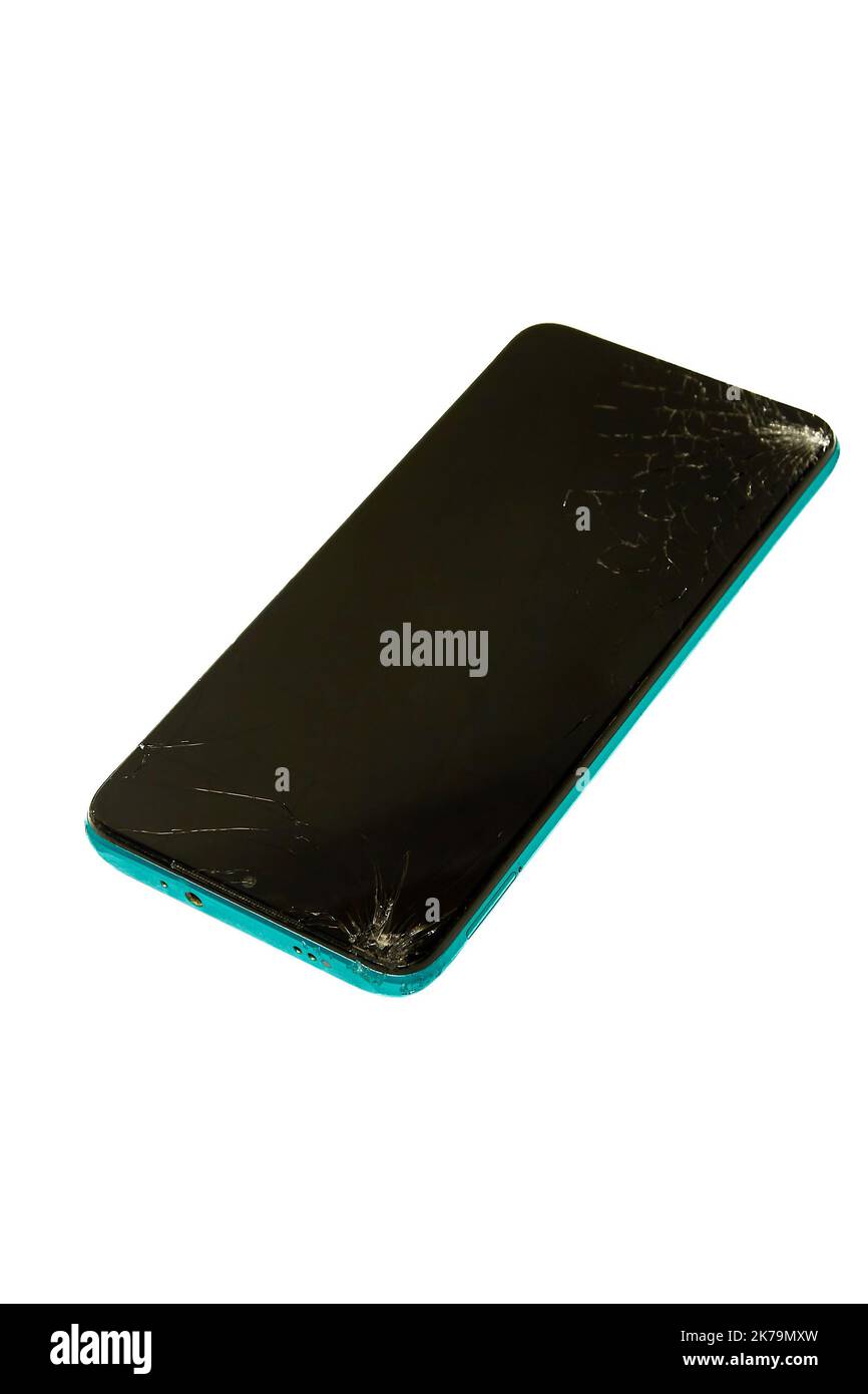 Damaged cell phone screen after a fall against a white background ...
