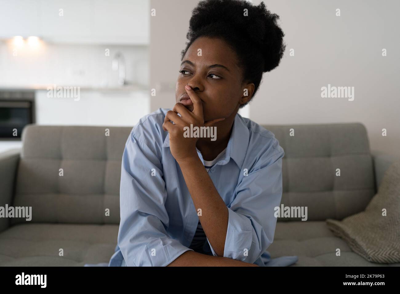 Thoughtful African American woman reflects on problems and troubles ...