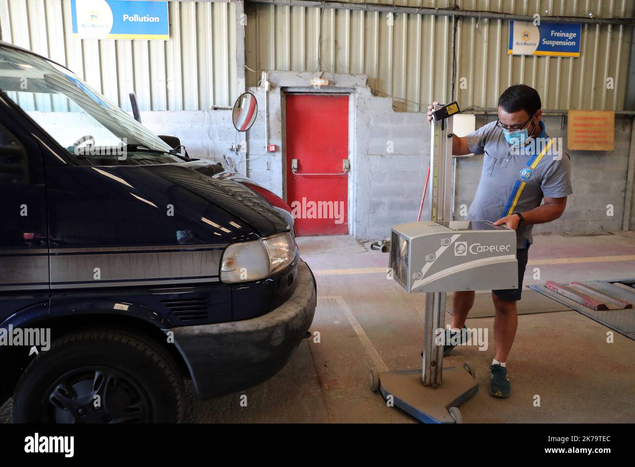 Latresne, France. Vehicle technical control. Garages reopen to work on ...