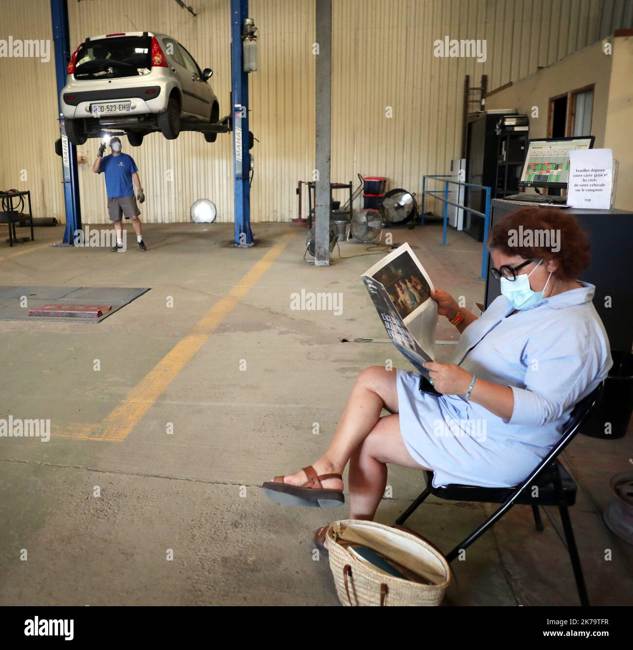 Latresne, France. Vehicle technical control. Garages reopen to work on ...