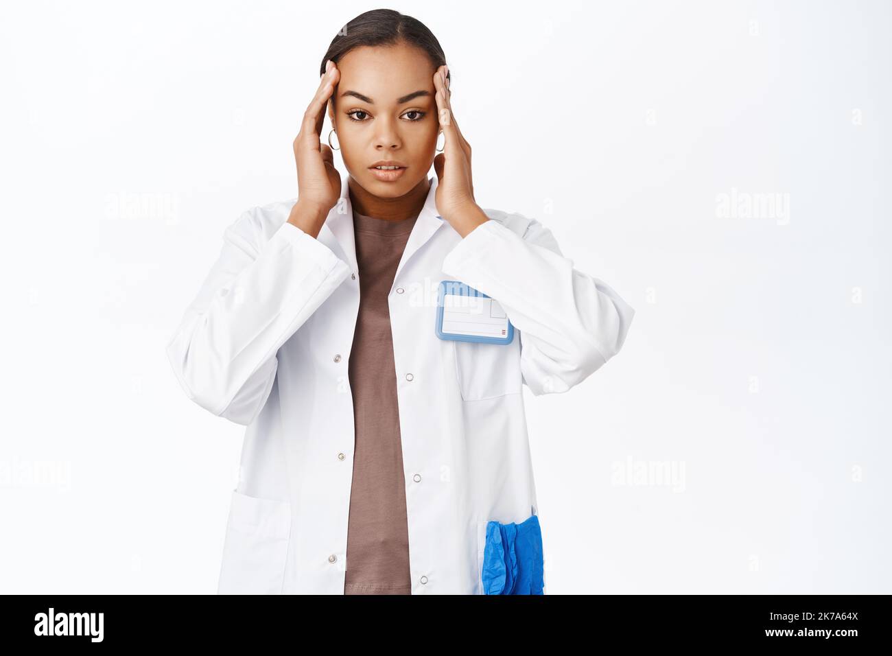 Therapist, female doctor holding head and looking concerned, having ...