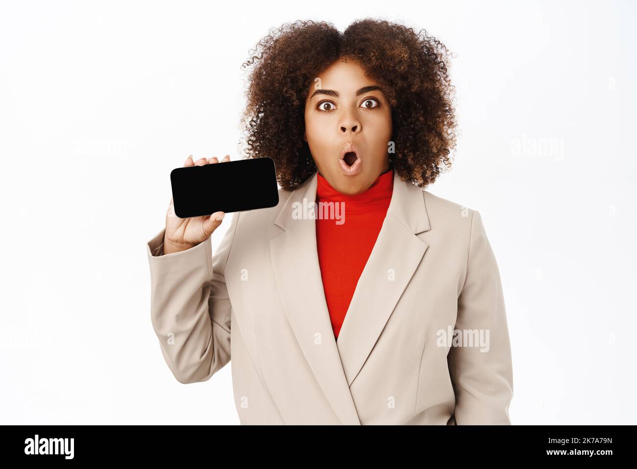 Image of african american businesswoman shows mobile phone horizontal ...